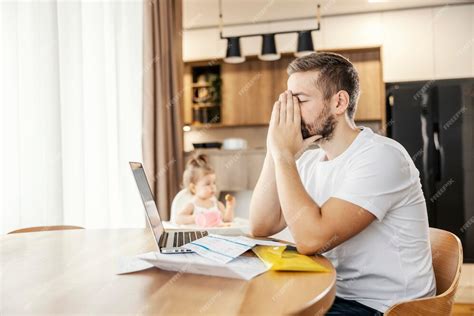 Premium Photo A Sorrowful Man Is Having Problem With Paying Bills And