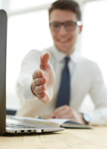 Premium Photo Businessman Extending Hand To Shake At Office