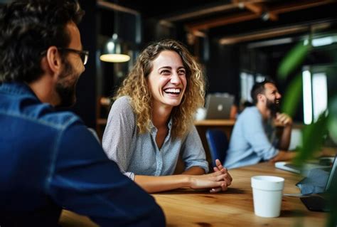 Premium Ai Image A Couple Enjoying A Lighthearted Moment At A Table