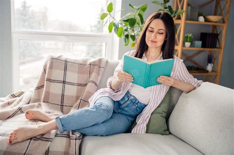 Full Size Portrait Of Peaceful Pretty Girl Sit Barefoot Comfy Sofa Read