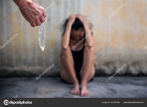 Man Hand Holding Used Condom White Semen Sperm While Stressed Stock