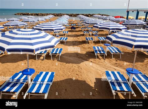 Sun Umbrellas And Sun Beds On A Beach Marina Di Ragusa Sicily Italy