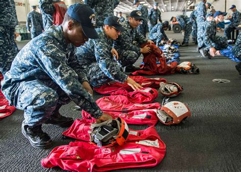 Aviation Boatswains Mate Airman Aw Rakim Elmore Inspects A Float