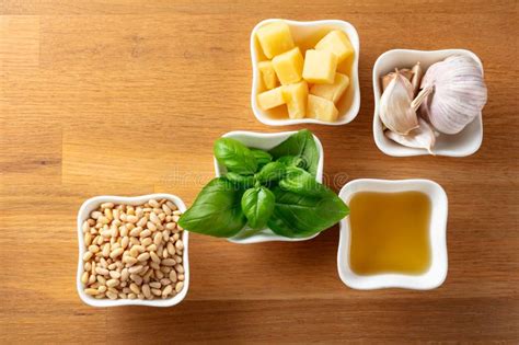 Ingredients For Traditional Italian Pesto Recipe On A Wooden Background