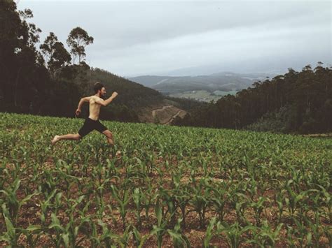 Premium Photo Full Length Of Shirtless Man Running On Field
