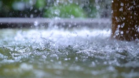 Beautiful Summer Heavy Rain Raindrops Falling Into The Water Splashing