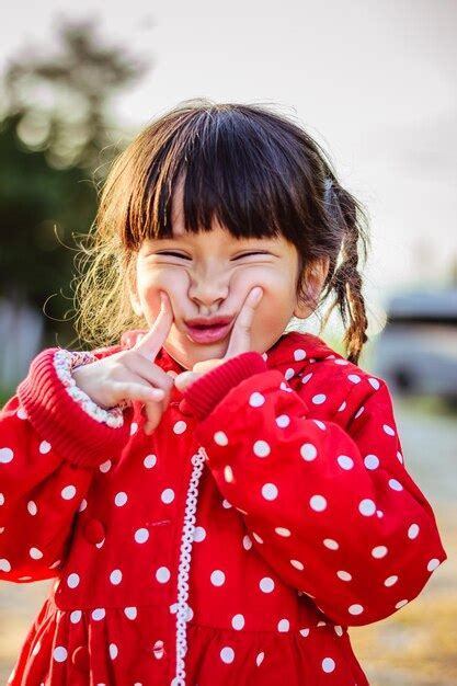 Premium Photo Close Up Of Innocent Girl Making Face