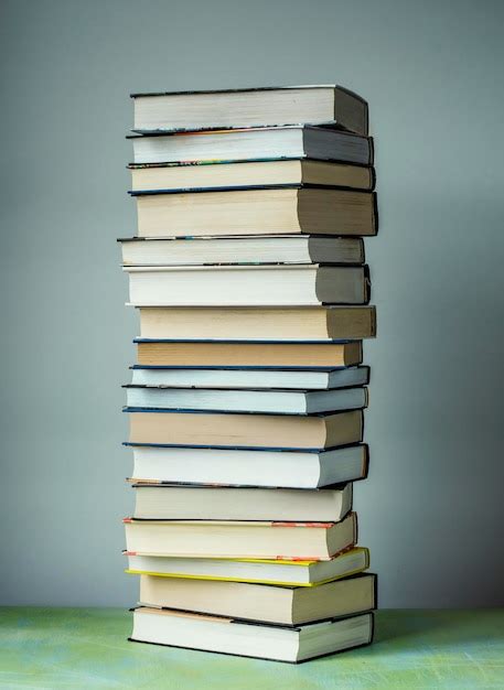 Premium Photo Stack Of Books On Table