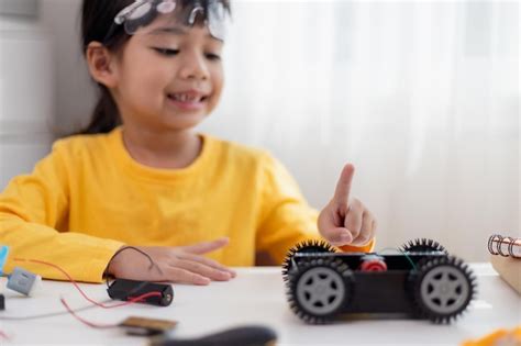 Premium Photo Asia Students Learn At Home In Coding Robot Cars And