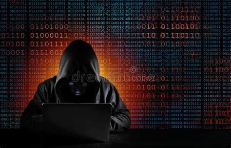 Dangerous Anonymous Hacker Man In Black Hooded And Masked Using Computer Breaking Into Security