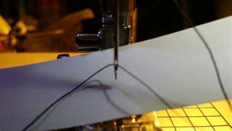 Threading A Machine Needle Use A Piece Of White Paper Behind The