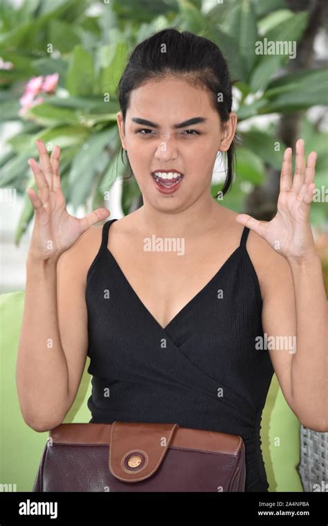 Stressed Youthful Asian Girl While Sitting Stock Photo Alamy