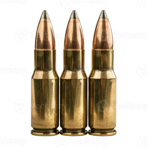 A Close Up View Of Three Brass Bullets With Pointed Copper Tips