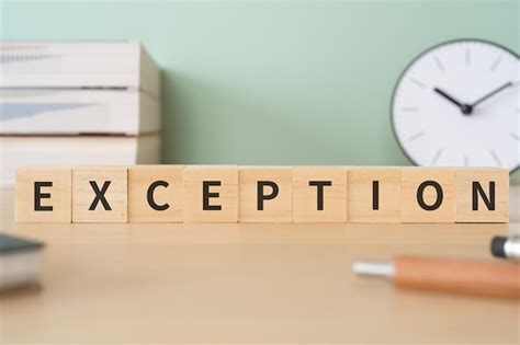 premium photo wooden blocks with exception text of concept pens