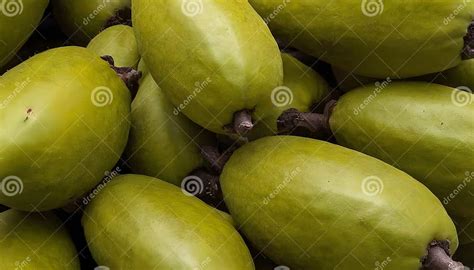 An Up Close Look At A Group Of Ripe Vivid Pawpaw With Intricate