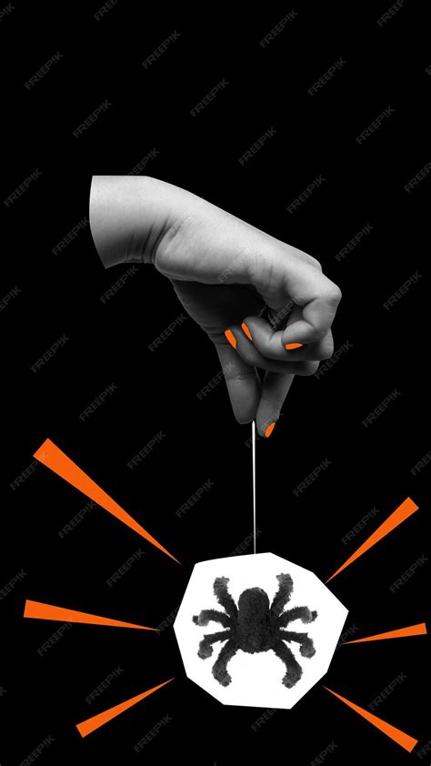 Premium Photo A Hand Holding A Thread With A Spider On A String