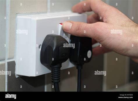Someone Switching On An Electrical Socket Stock Photo Alamy