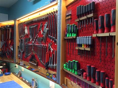 Wall Control Red Metal Pegboard Built Into Folding Cabinet Doors