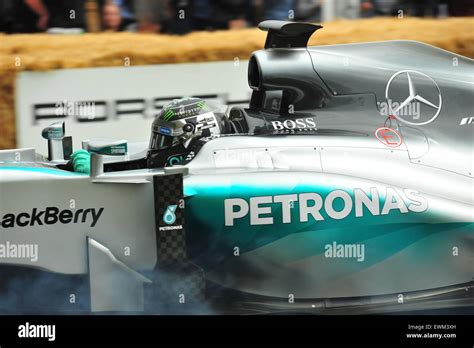 Nico Rosberg Drives A 2013 Mercedes MGP W04 F1 Car At The Goodwood