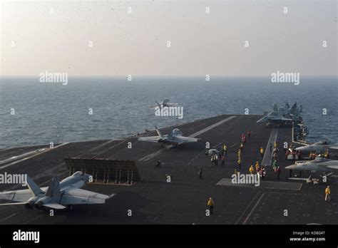 Flight Operations Aboard The Flight Deck Of Uss Nimitz Aircraft Carrier