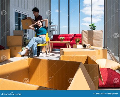 Asian Adult Woman Tired And Headache While Sitting With Legs Crossed On