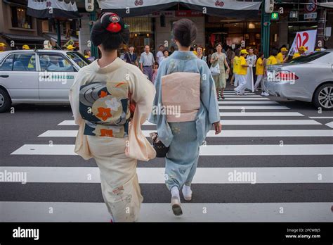Geisha And Maiko Geisha Apprentice In Shijo Dori Streetgeishas