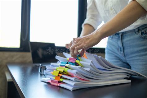Businesswoman Hands Working On Stacks Of Paper Documents To Search And