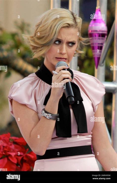 Katy Perry Wears A Form Fitting Pink Satin Dress As She Promotes Her