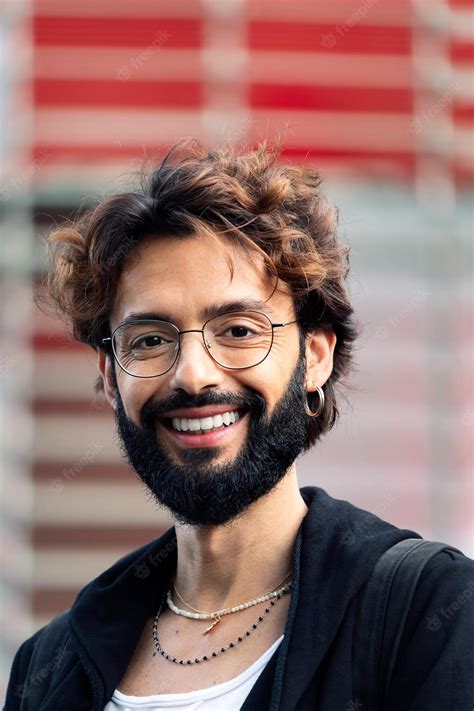 Premium Photo Smiling Young Man With Glasses And Beard