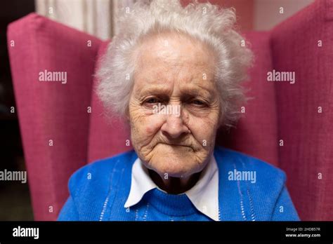 Elderly Couple In Their Eighties Sitting Together At Their Residential