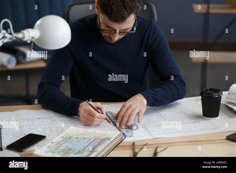 Architect Working In Office With Blueprintsengineer Inspect Architectural Plan Sketching A