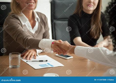 Diverse Businesswomen Shaking Hands At Group Meeting Or Job Inte Stock