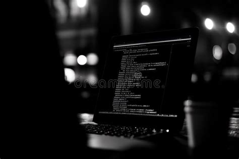 Coding Session In A Dimly Lit Cafe During Late Night Hours Stock Image