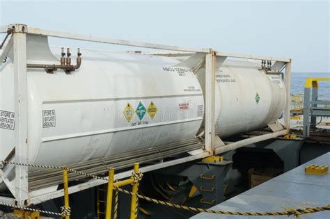 Two White Container Lashed With Bars And Twist Locks On Deck Of Ship