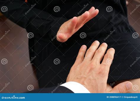 Businessman Sexually Harassing Female Colleague By Trying To Touch Her