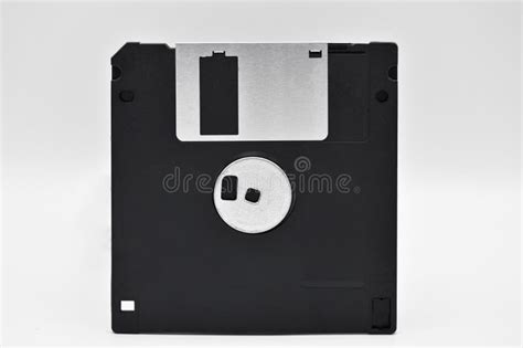 Old Computer And Data Storage Technology Black Magnetic Floppy Disk 3Â½ Inches Isolated On