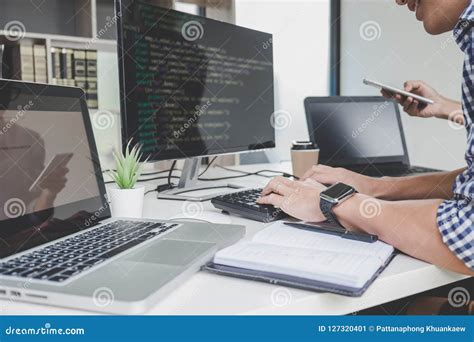 Programmers Cooperating At Developing Programming And Website Working