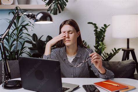 stressed girl suffer from headache bad vision sight problem sit at home