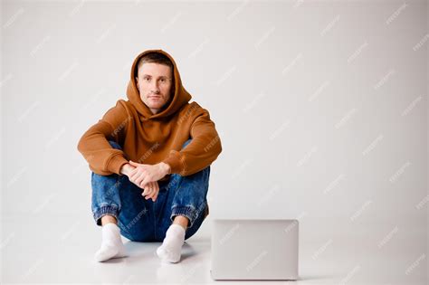 Premium Photo Programmer Working Behind The Desk Analysing Code On The Black Screen