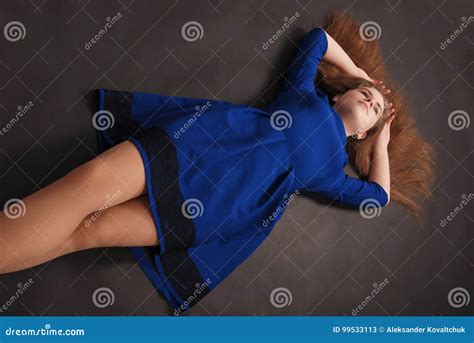 Young Girl With In Blue Dress Lying On The Floor Stock Image Image Of