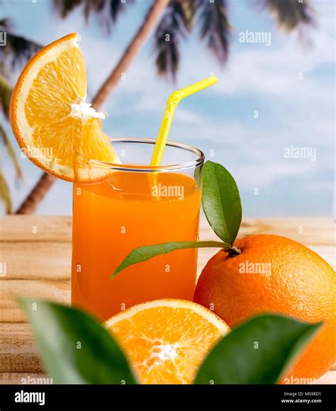 Fresh Orange Juice Representing Tropical Fruit And Thirsty Stock Photo - Alamy