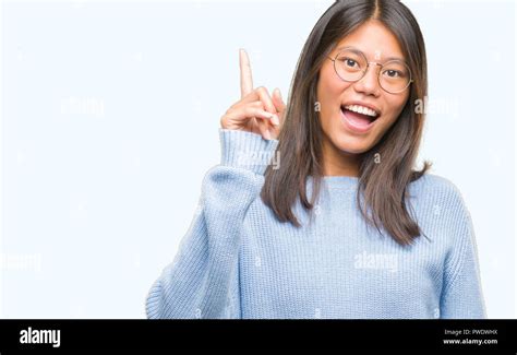 Young Asian Woman Wearing Winter Sweater Over Isolated Background