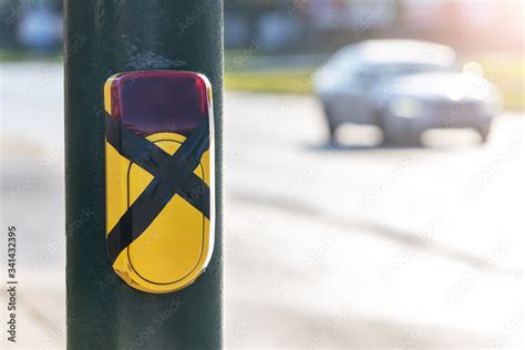 Turned Off A Traffic Light Button For Crossing Roadway With Blurred Bus