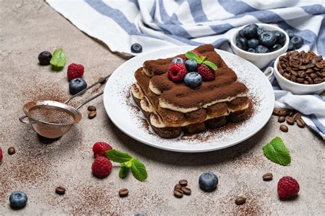 Premium Photo Classic Tiramisu Dessert With Berries