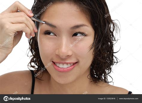 Woman Shapes Her Eyebrows Stock Photo MicrostockAsia