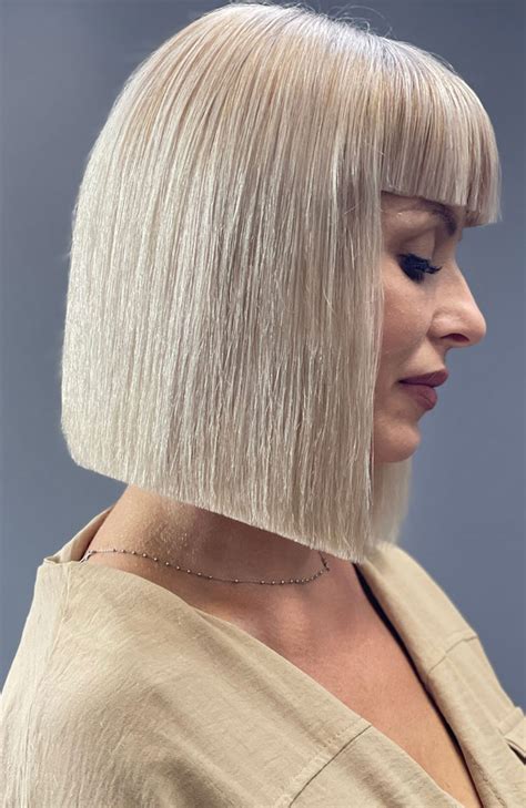 Ultra Sleek Platinum Blunt Bob With Bangs For A Bold Statement