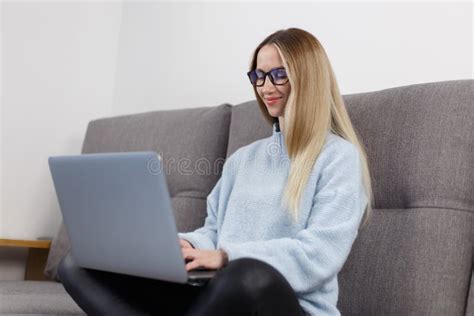 Cheerful Blonde Woman In Glasses Working On Laptop Computer At Home Young Adult Female Person