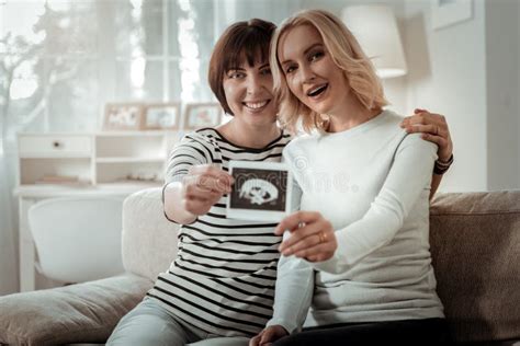 Beaming Same Sex Couple Showing Ultrasound Photo Stock Photo Image Of Impatient Equality
