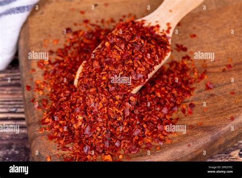 Dried Red Pepper Flakes Spice Chili Pepper Flakes In Wooden Spoon On