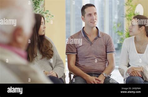 4k People In Group Therapy Session Hold Hands And Bow Their Heads To